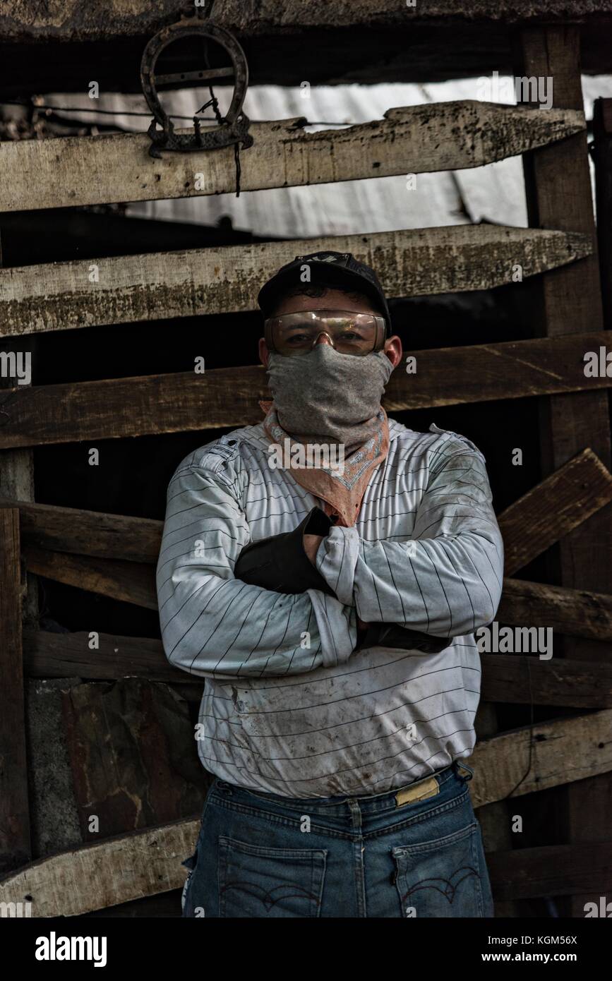 Portrait of an indigenous Purepecha coppersmith a copper workshop in ...