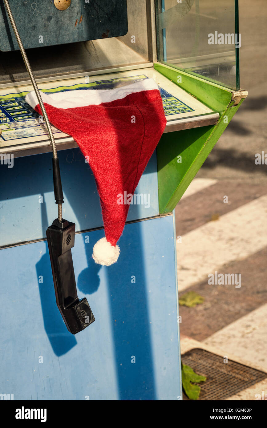 Phone booth with a Santa hat, calling Santa, a Christmas season concept ...