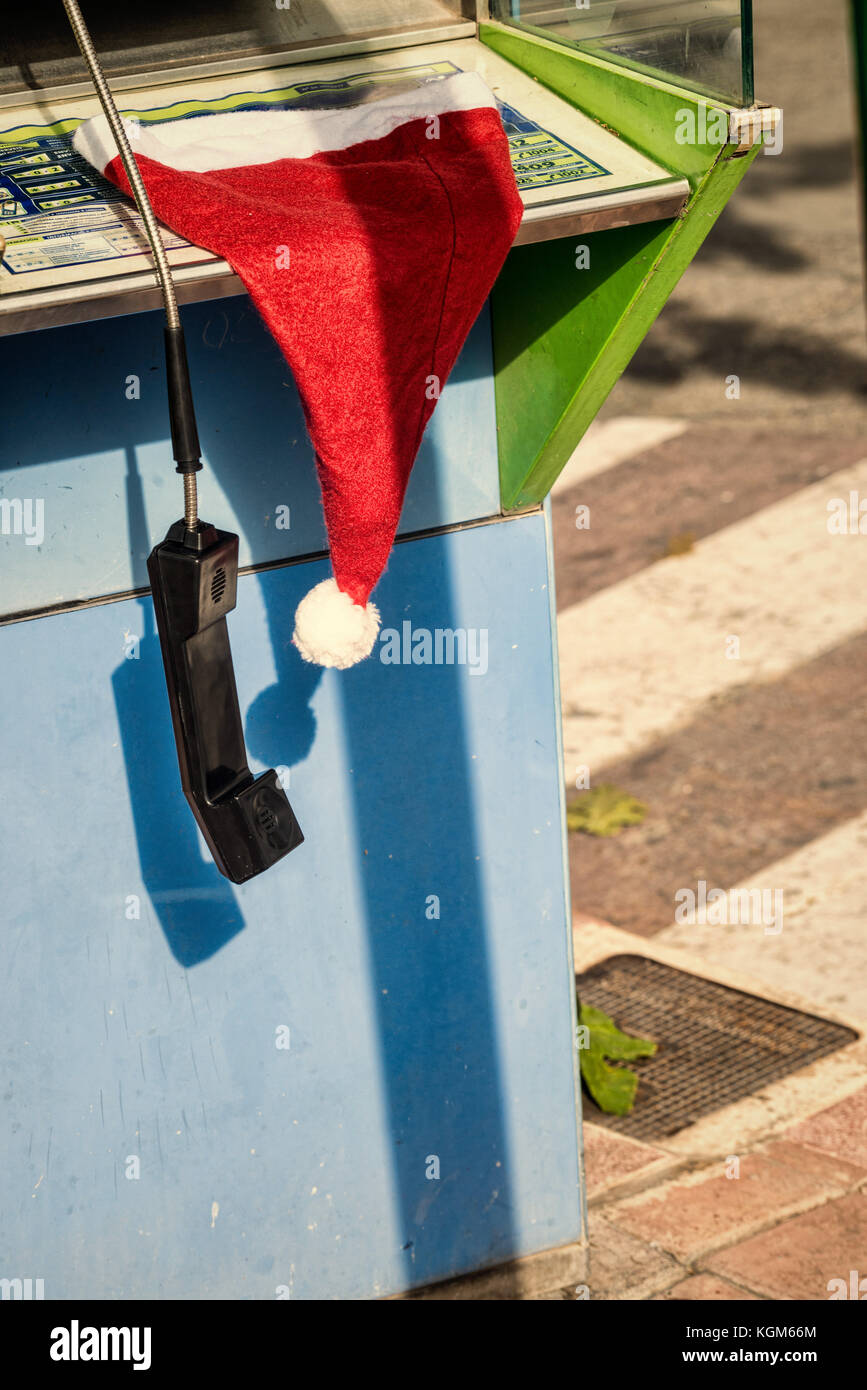 Phone booth with a Santa hat, calling Santa, a Christmas season concept ...
