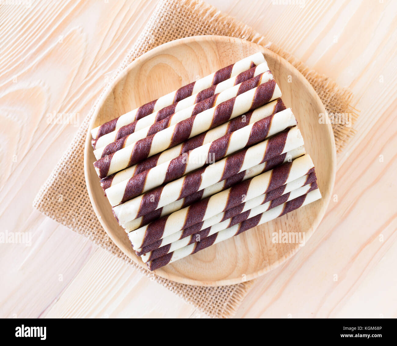 Mini chocolate stick wafer stick on wooden plate Stock Photo - Alamy