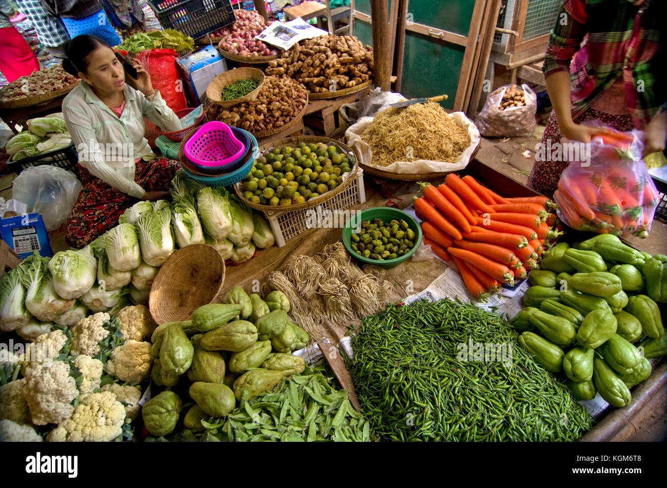 Women selling their fresh produce at the local market in Bagan daily ...