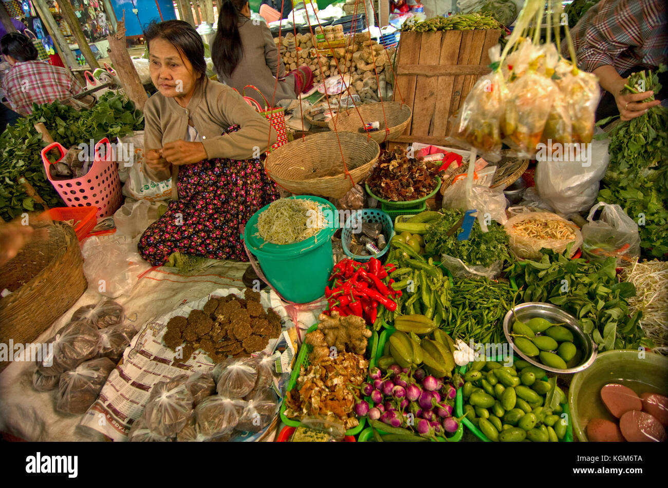 Women selling their fresh produce at the local market in Bagan daily ...