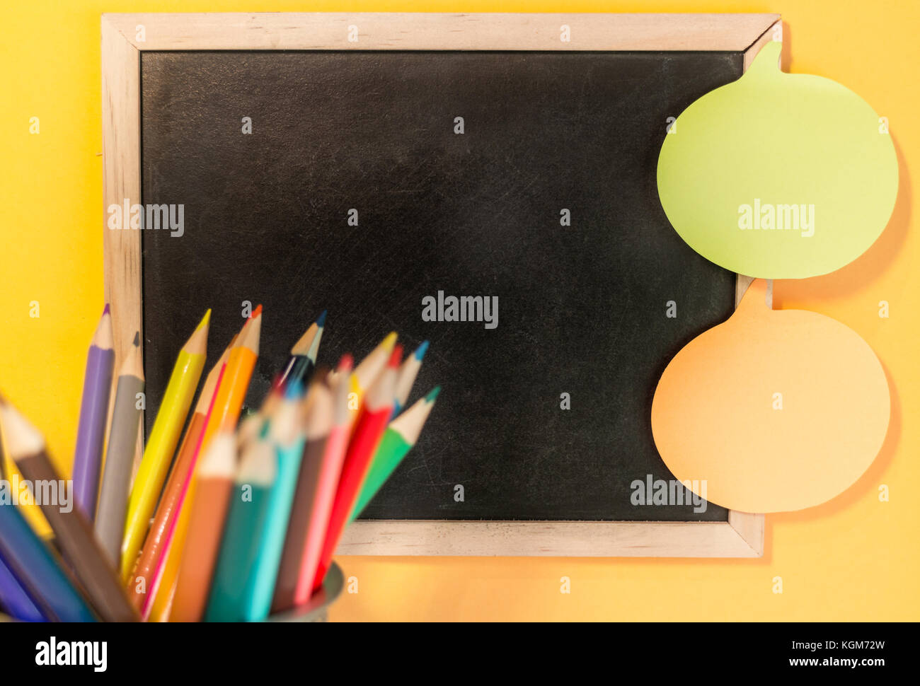 Black Chalk board with Sticky notes and Color pencils Stock Photo - Alamy