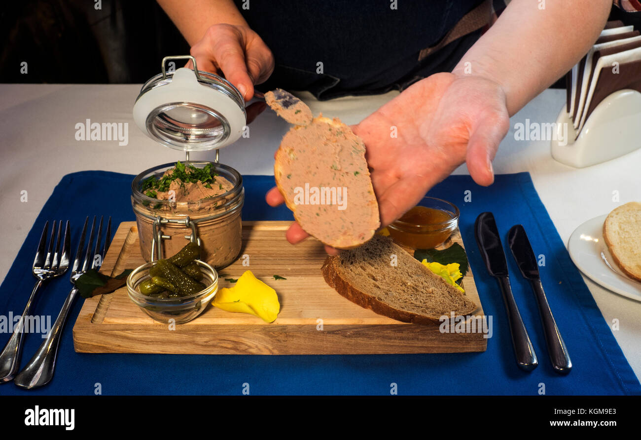 Woman spreads liver paste on bread Stock Photo - Alamy