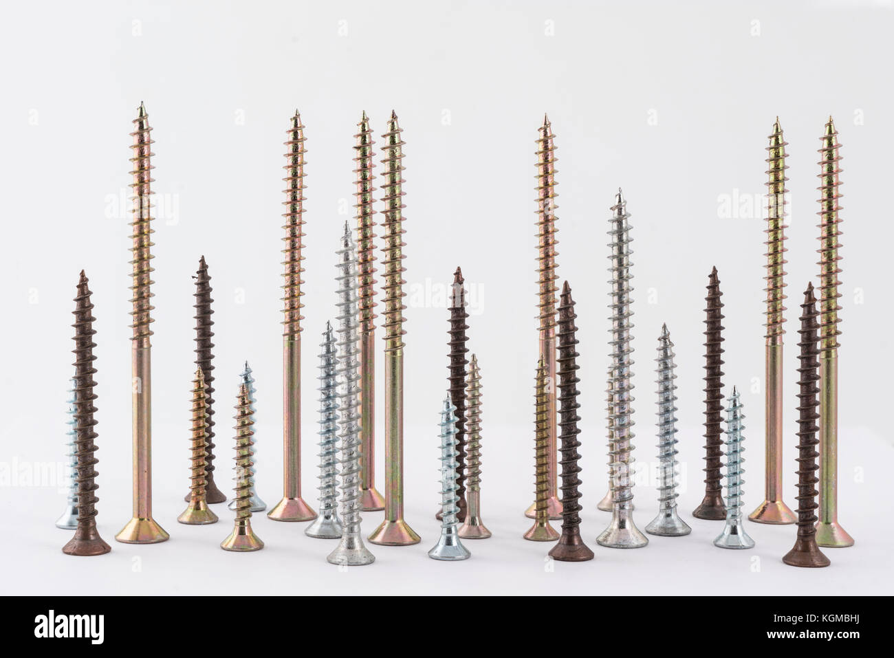 Some screws on a white background Stock Photo - Alamy