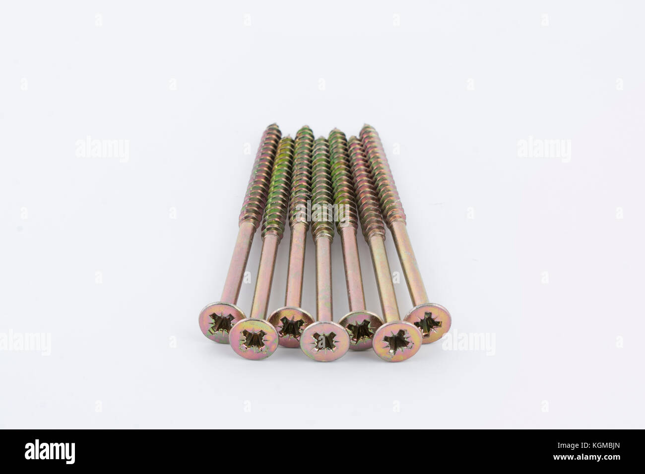 Some screws on a white background Stock Photo - Alamy