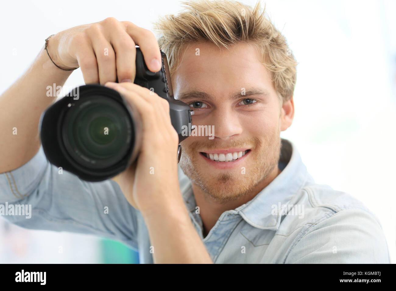 Fashion photographer shooting model in studio Stock Photo - Alamy