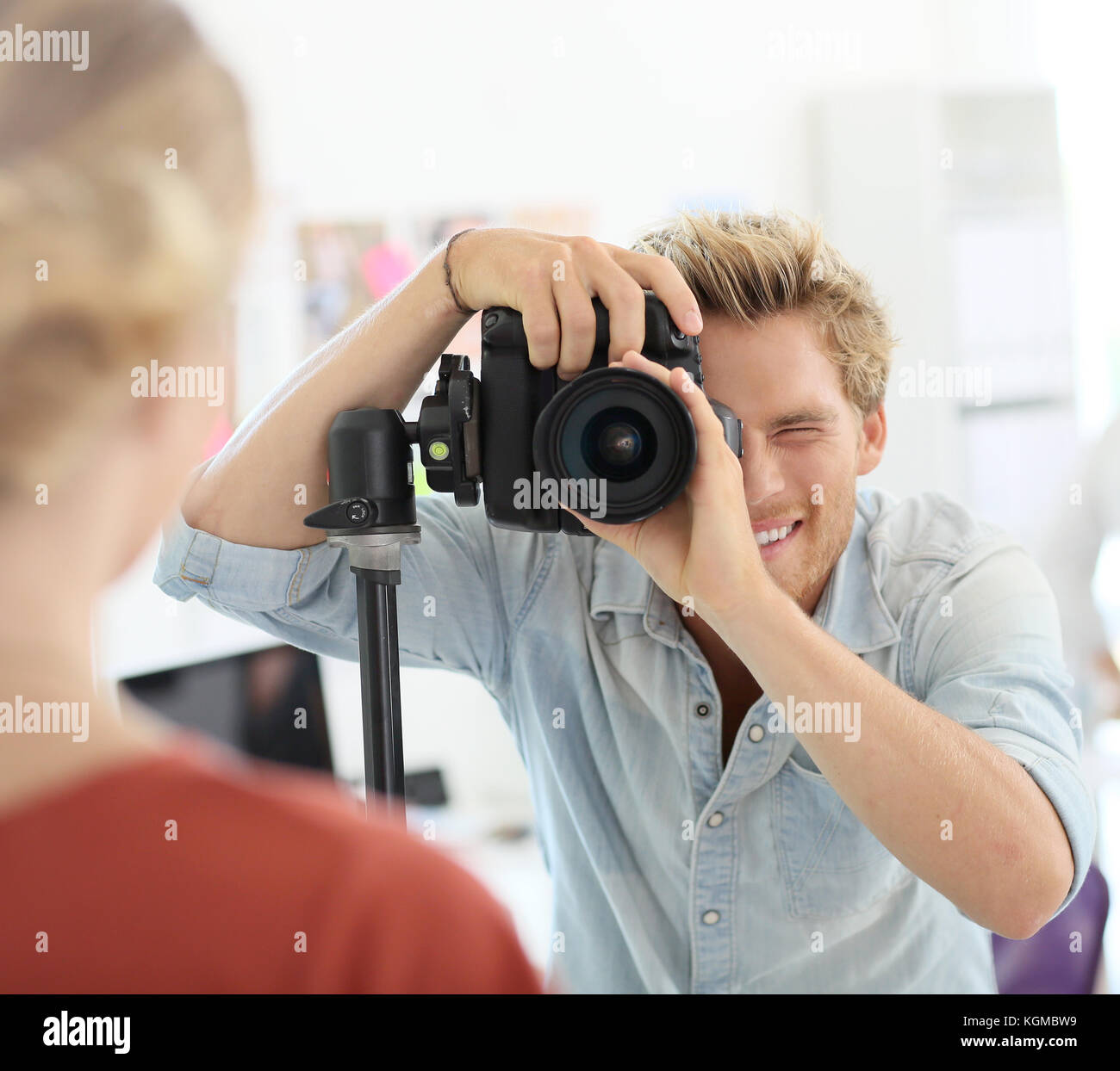 Fashion photographer shooting model in studio Stock Photo - Alamy