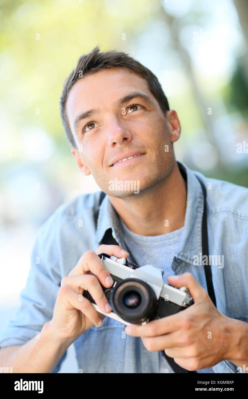 Photographer shooting outside with old camera Stock Photo - Alamy