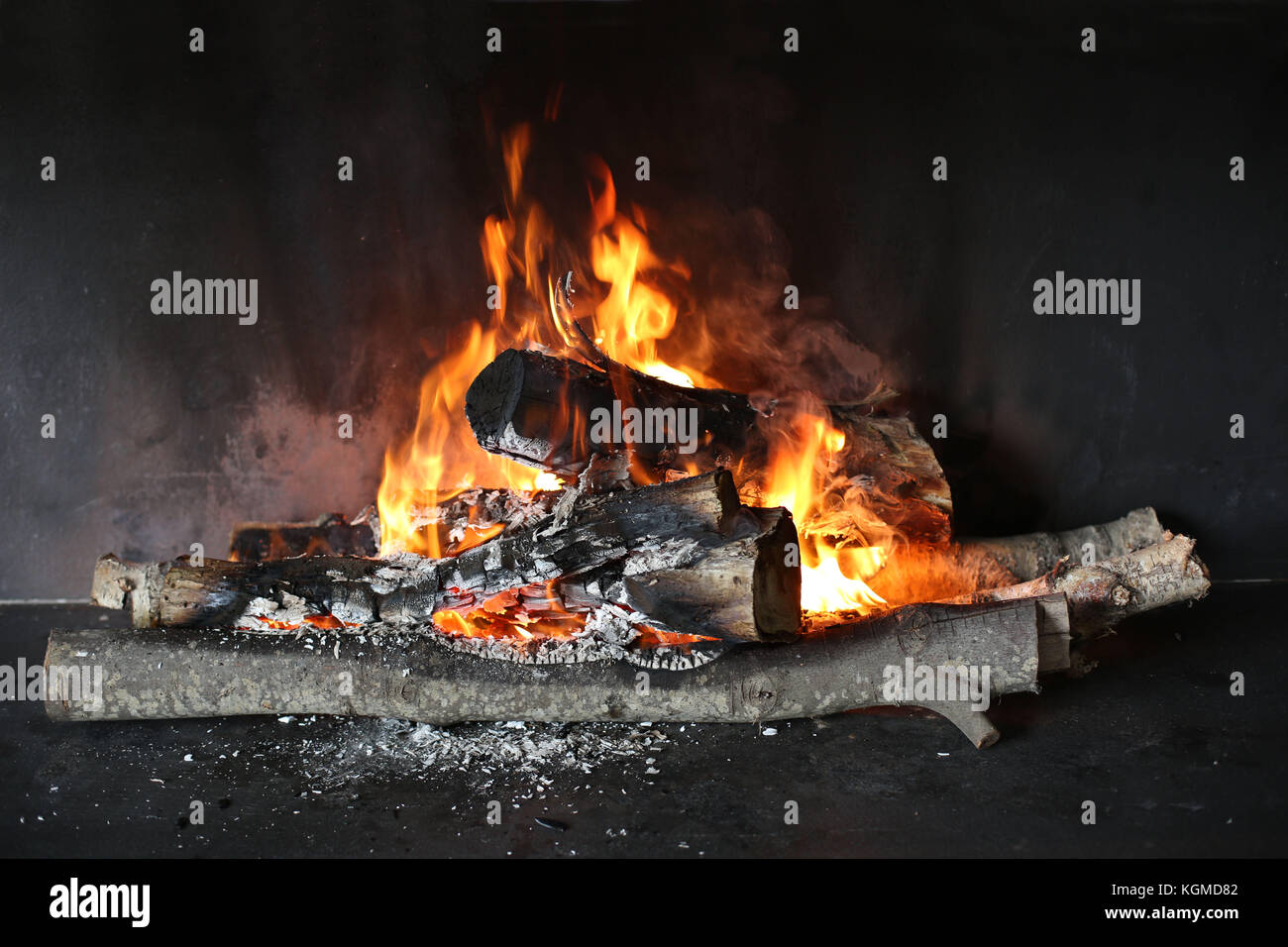 Closeup of wood burning in fireplace Stock Photo - Alamy