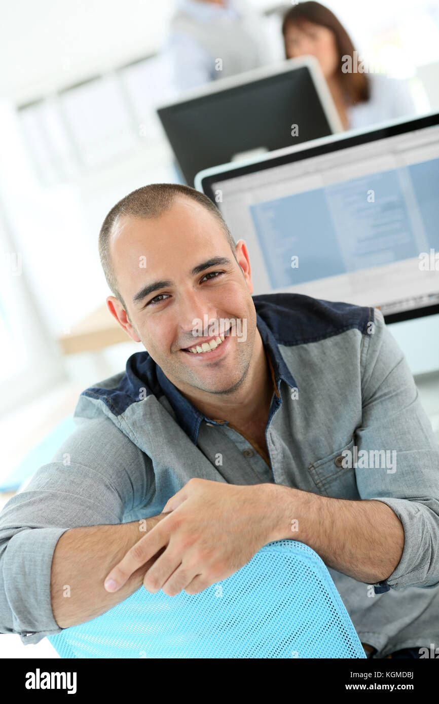 Portrait of student in front of desktop computer Stock Photo - Alamy
