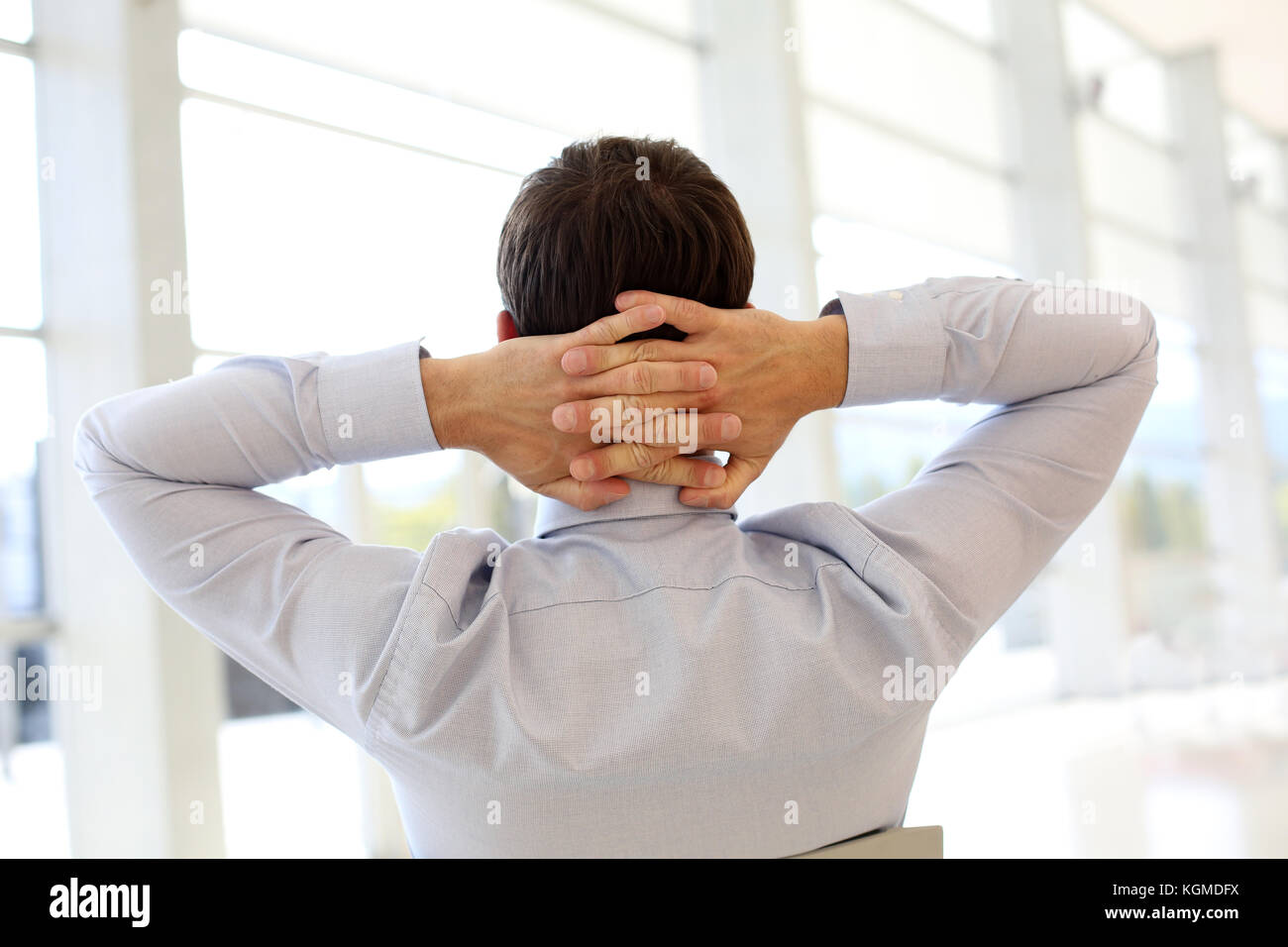 Closeup of man relaxing with arms on his neck Stock Photo - Alamy