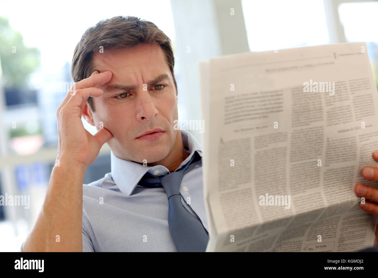 Businessman reading newspaper in office Stock Photo - Alamy Businessman reading newspaper in office Stock Photo - Alamy