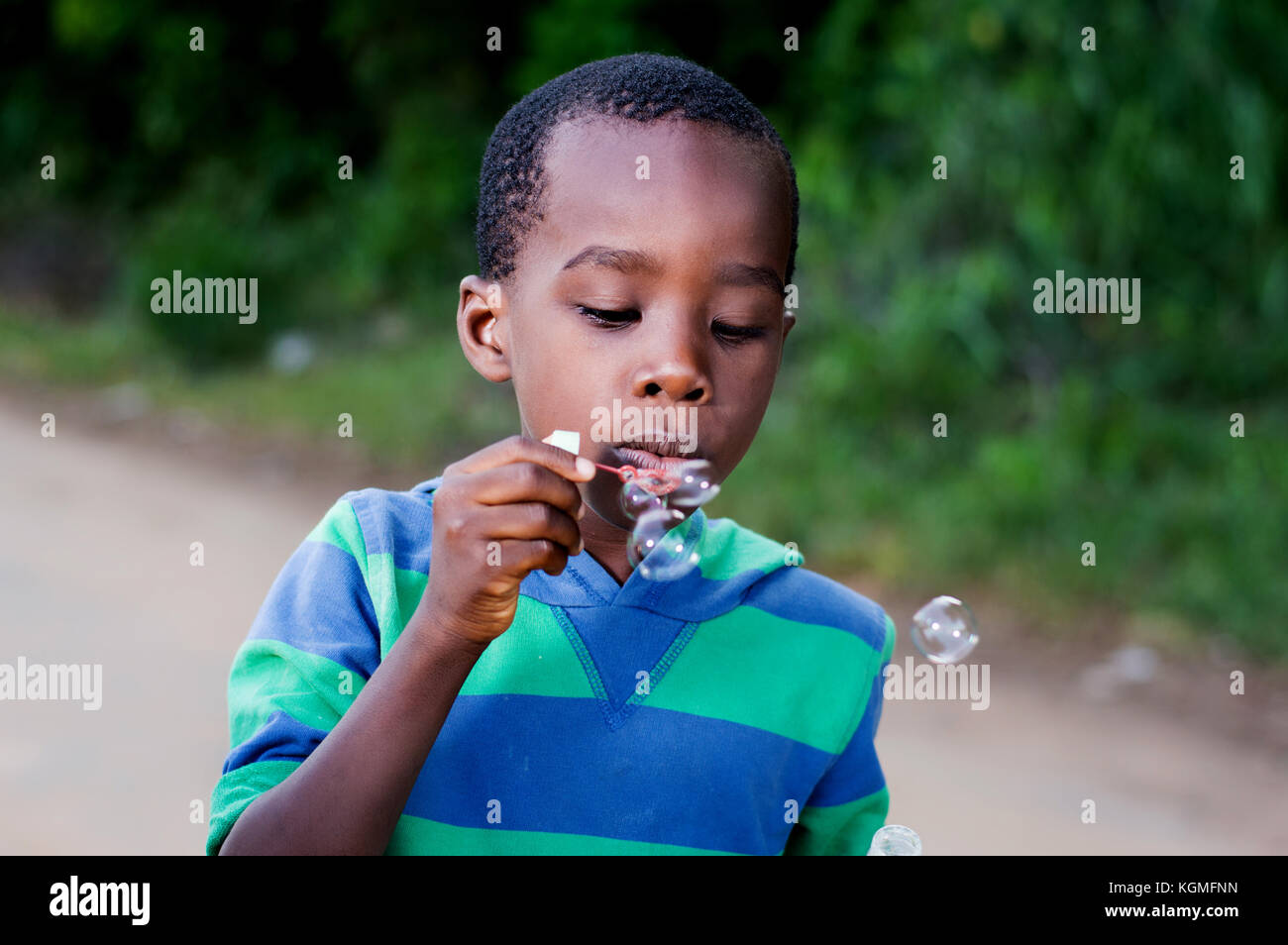 Beautiful boy blowing bubbles hi-res stock photography and images - Alamy