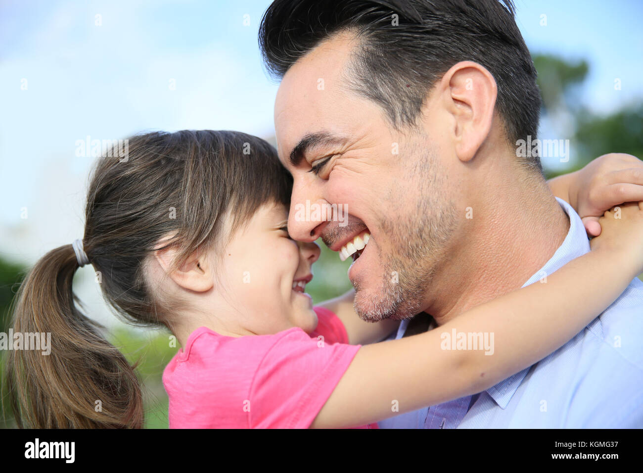 Portrait of little girl hugging her daddy Stock Photo - Alamy