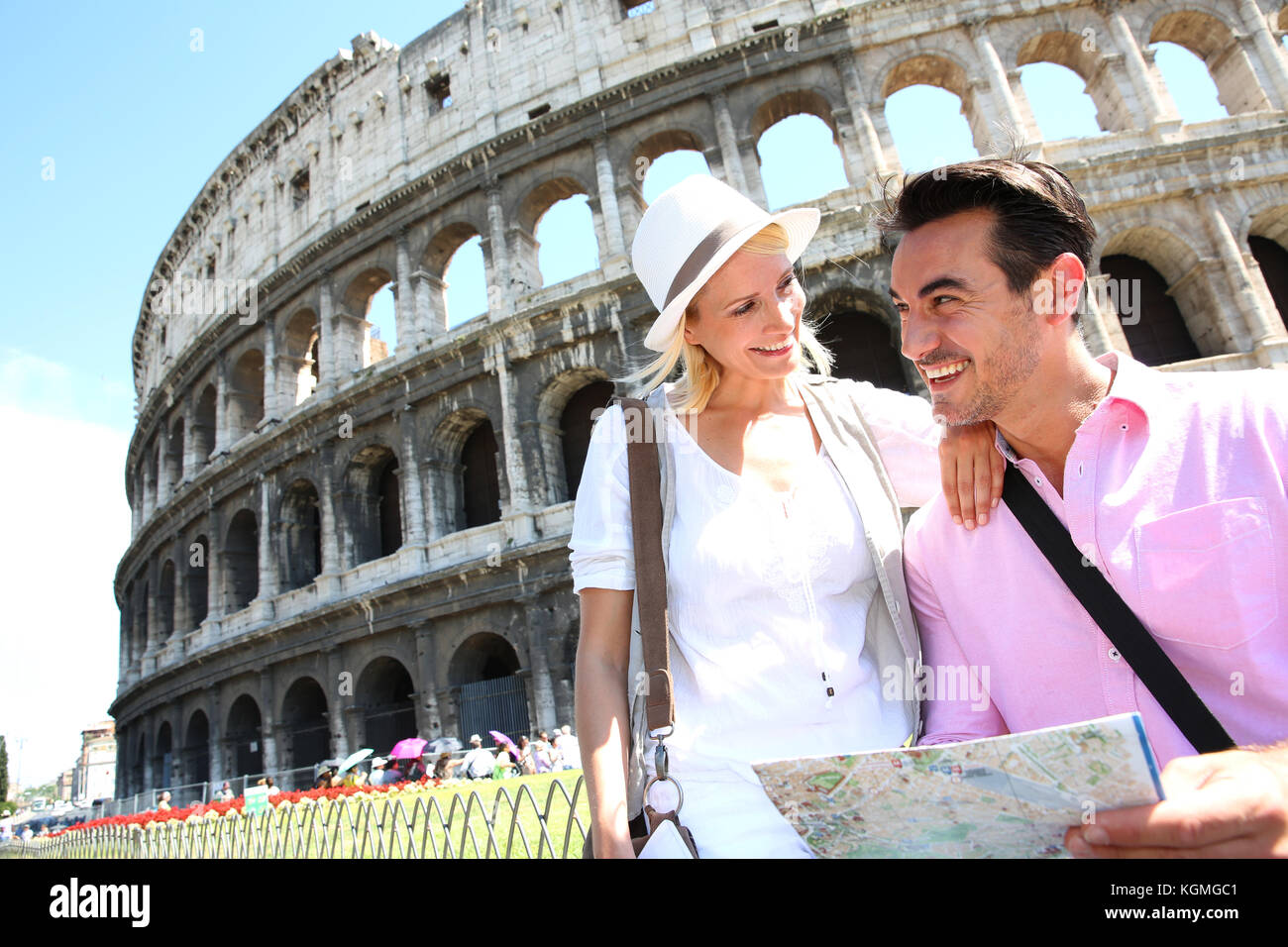 Tourists reading map in front of the Coliseum, Rome Stock Photo - Alamy