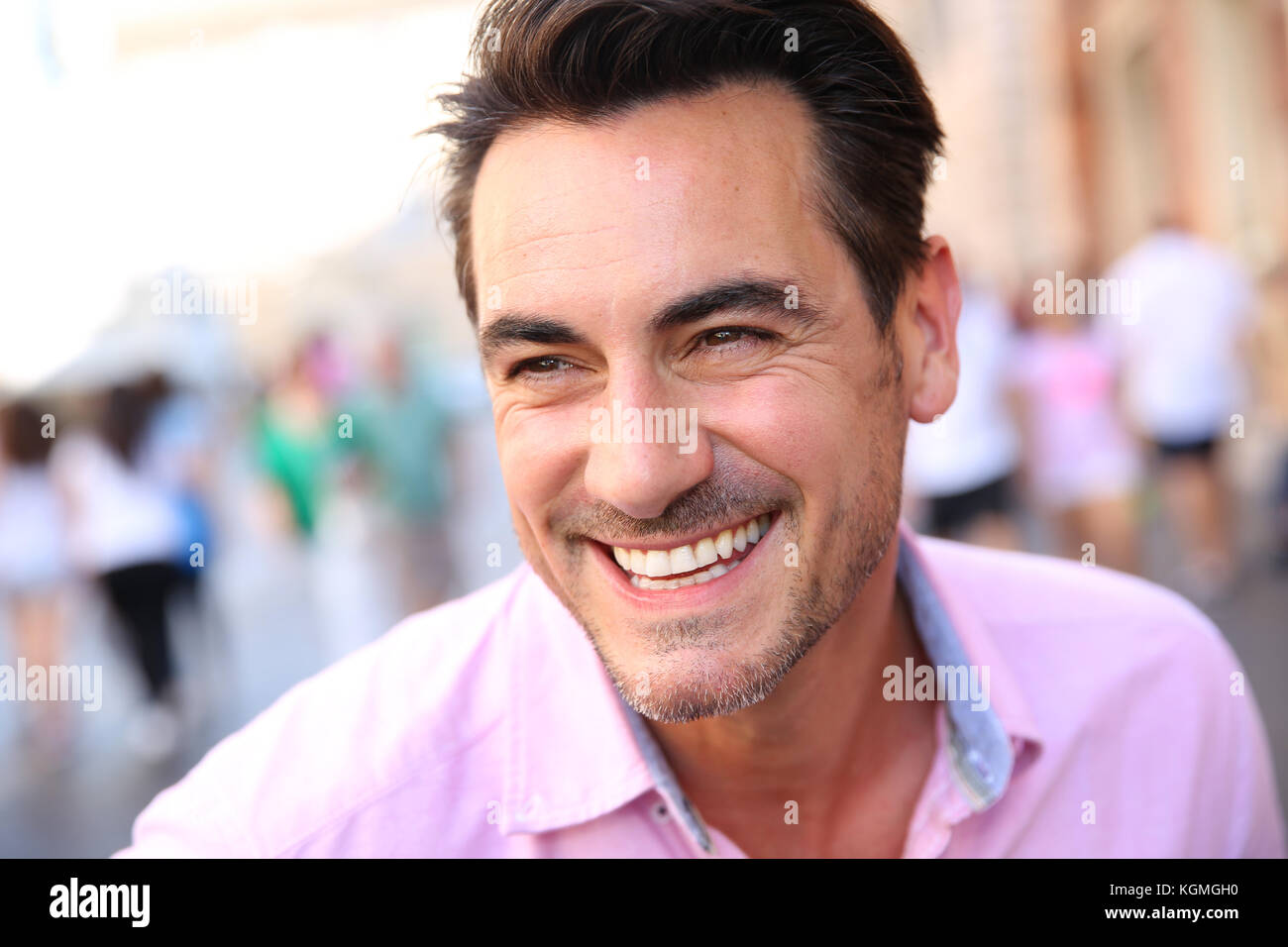Closeup of handsome guy wearing pink shirt Stock Photo - Alamy