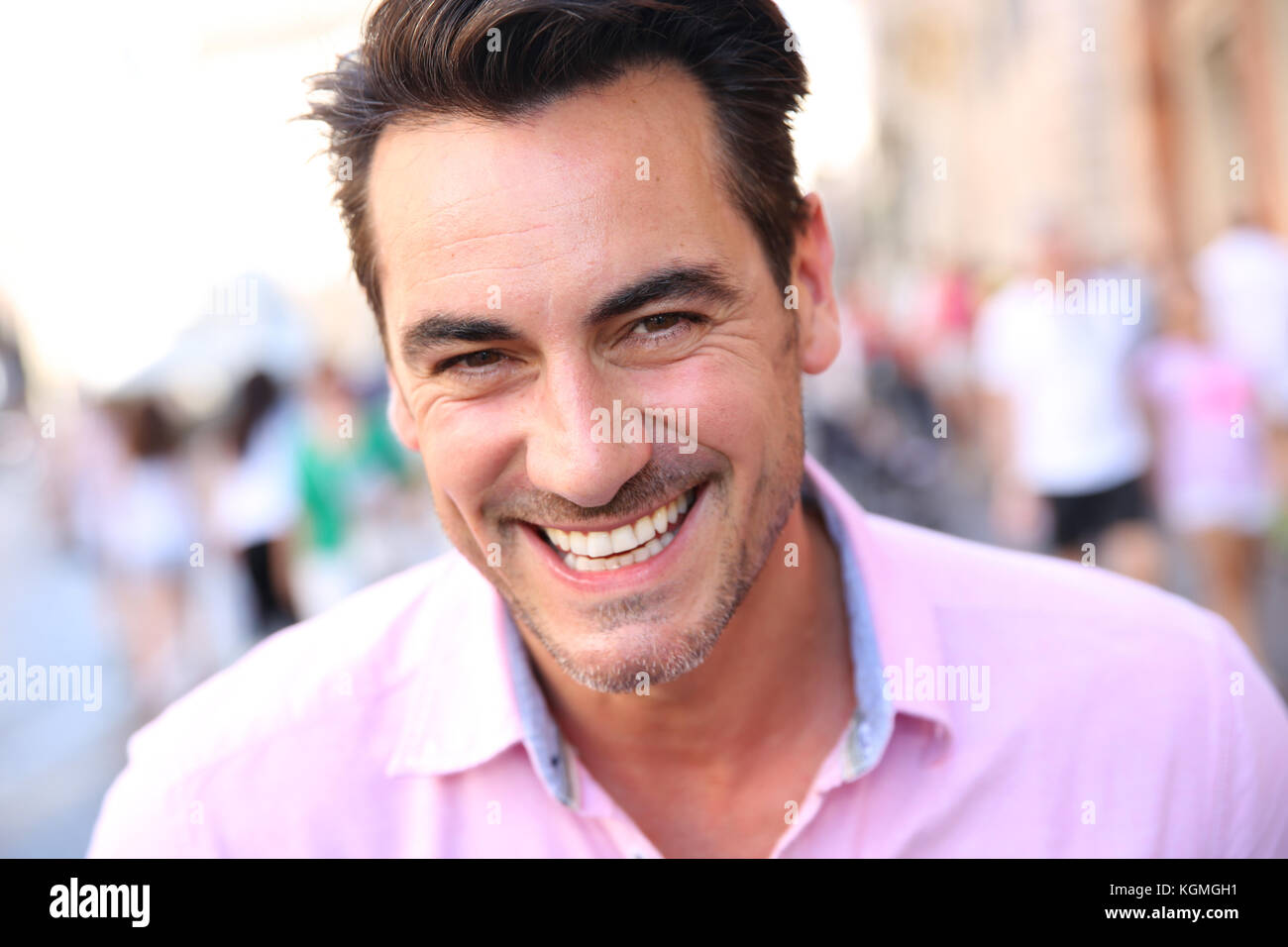 Closeup of handsome guy wearing pink shirt Stock Photo - Alamy