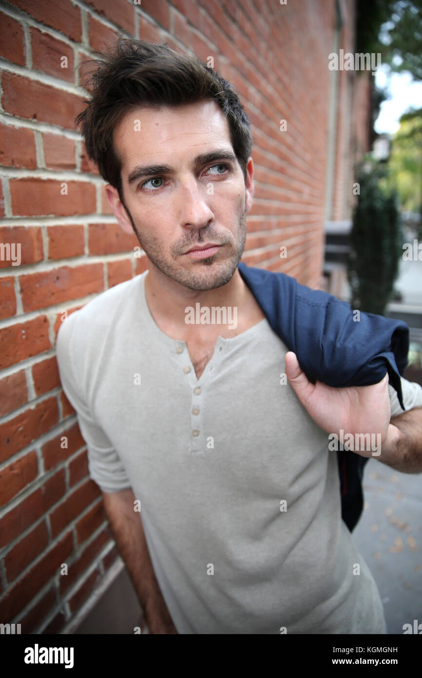 Man leaning on wall hi-res stock photography and images - Alamy