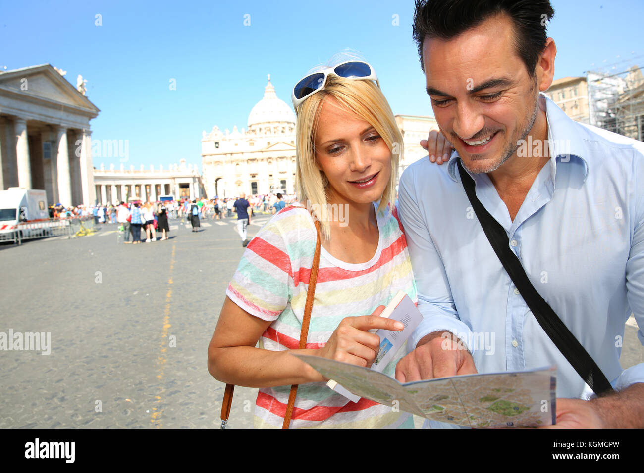 Tourits with map in front of Saint Peter's Basilica in Rome Stock Photo ...
