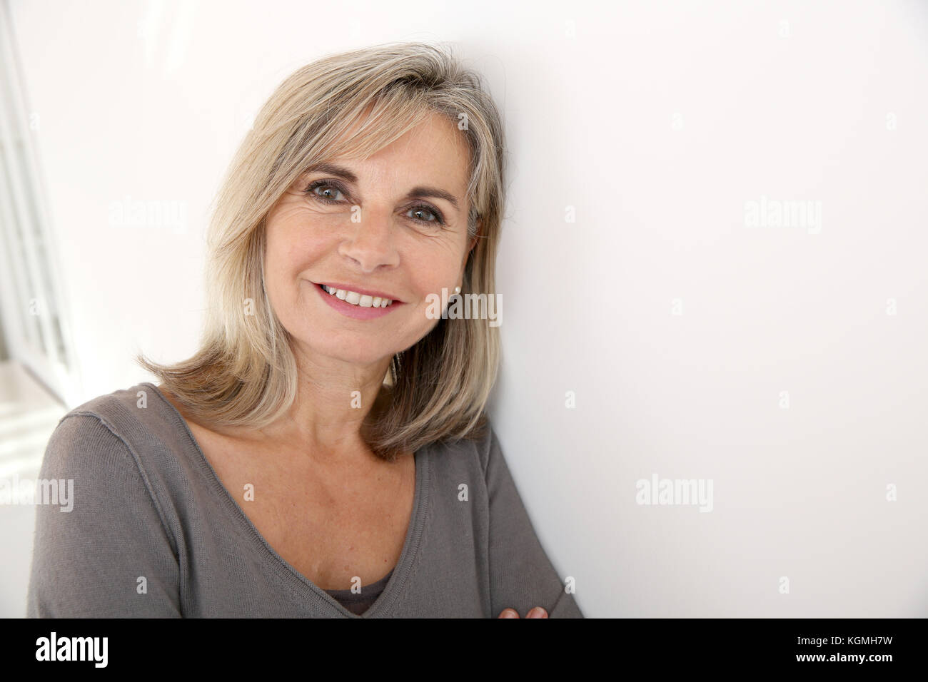 Portrait of smiling senior woman Stock Photo - Alamy