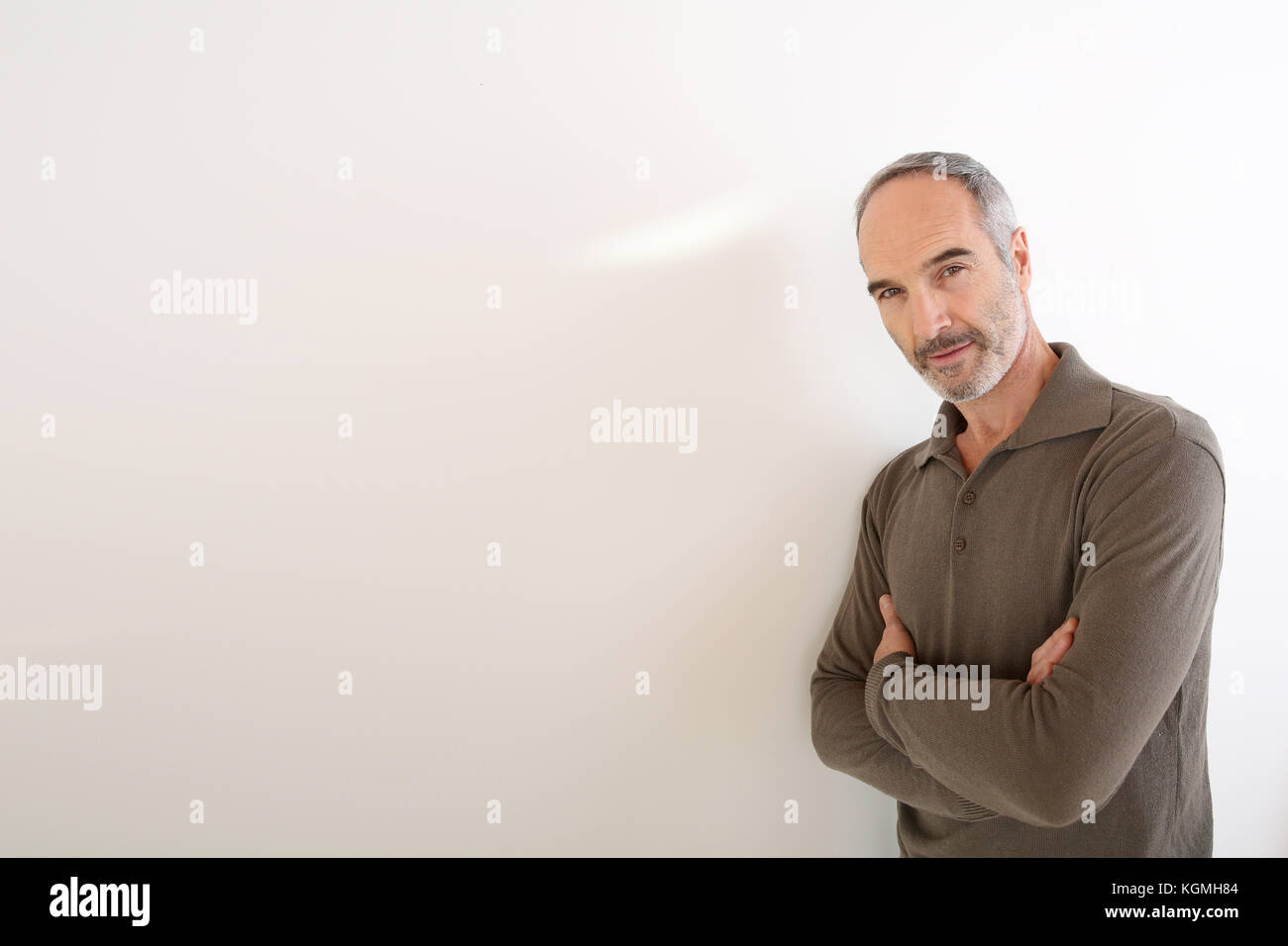 Portrait of 50-year-old man standing on white background Stock Photo ...