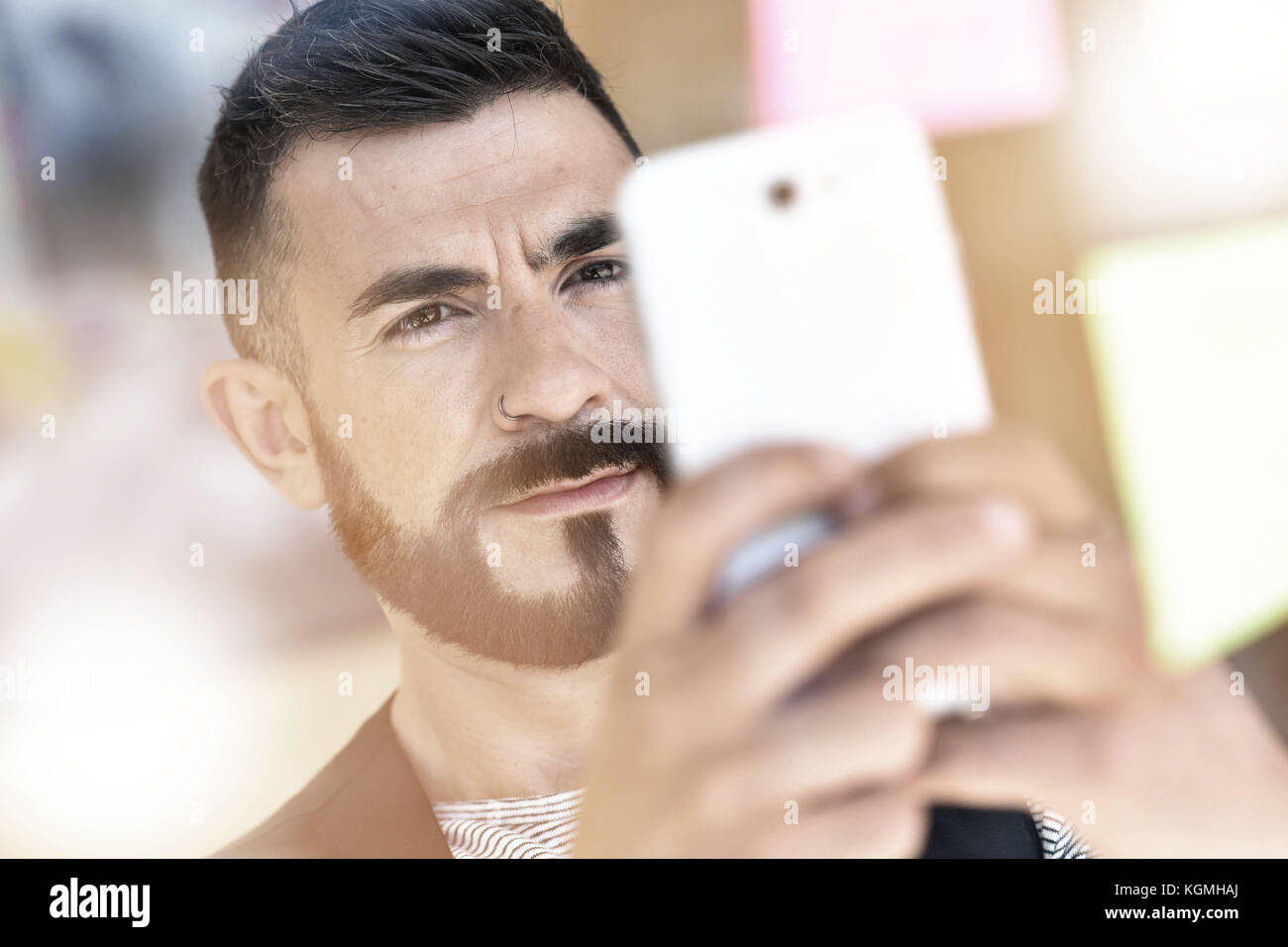 Man scanning notes with smartphone Stock Photo - Alamy
