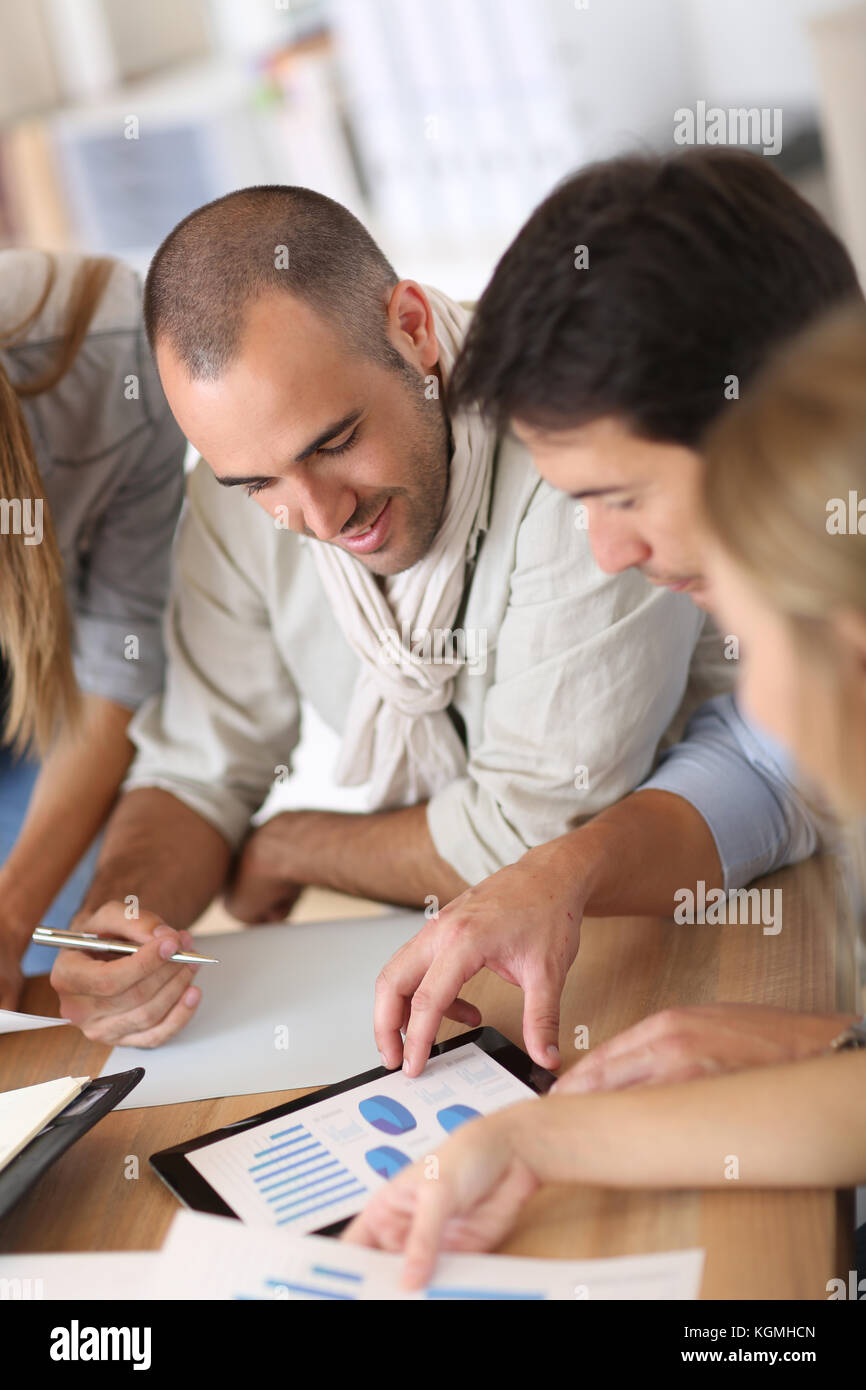 Business team working on marketing plan Stock Photo - Alamy