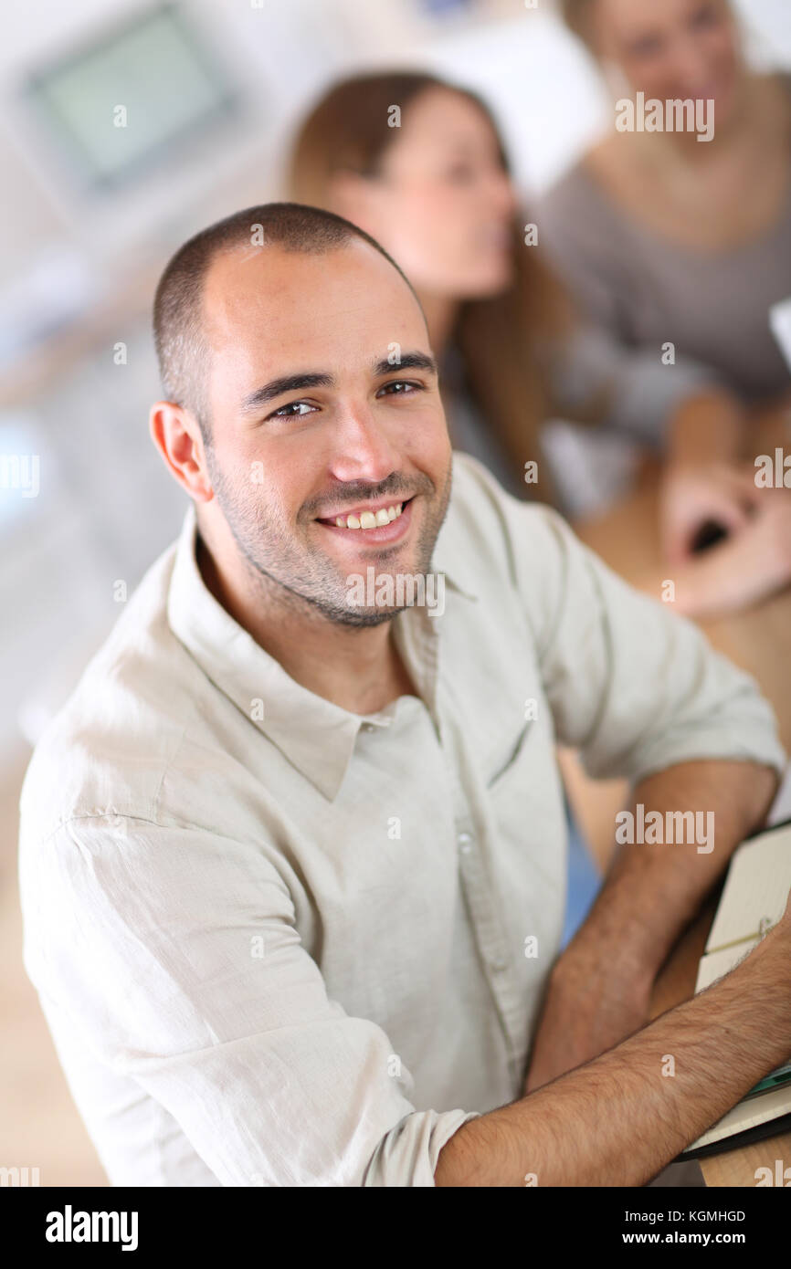 Young man attending business school project Stock Photo - Alamy