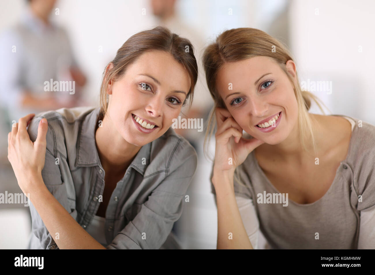 Portrait of working girls in office Stock Photo - Alamy