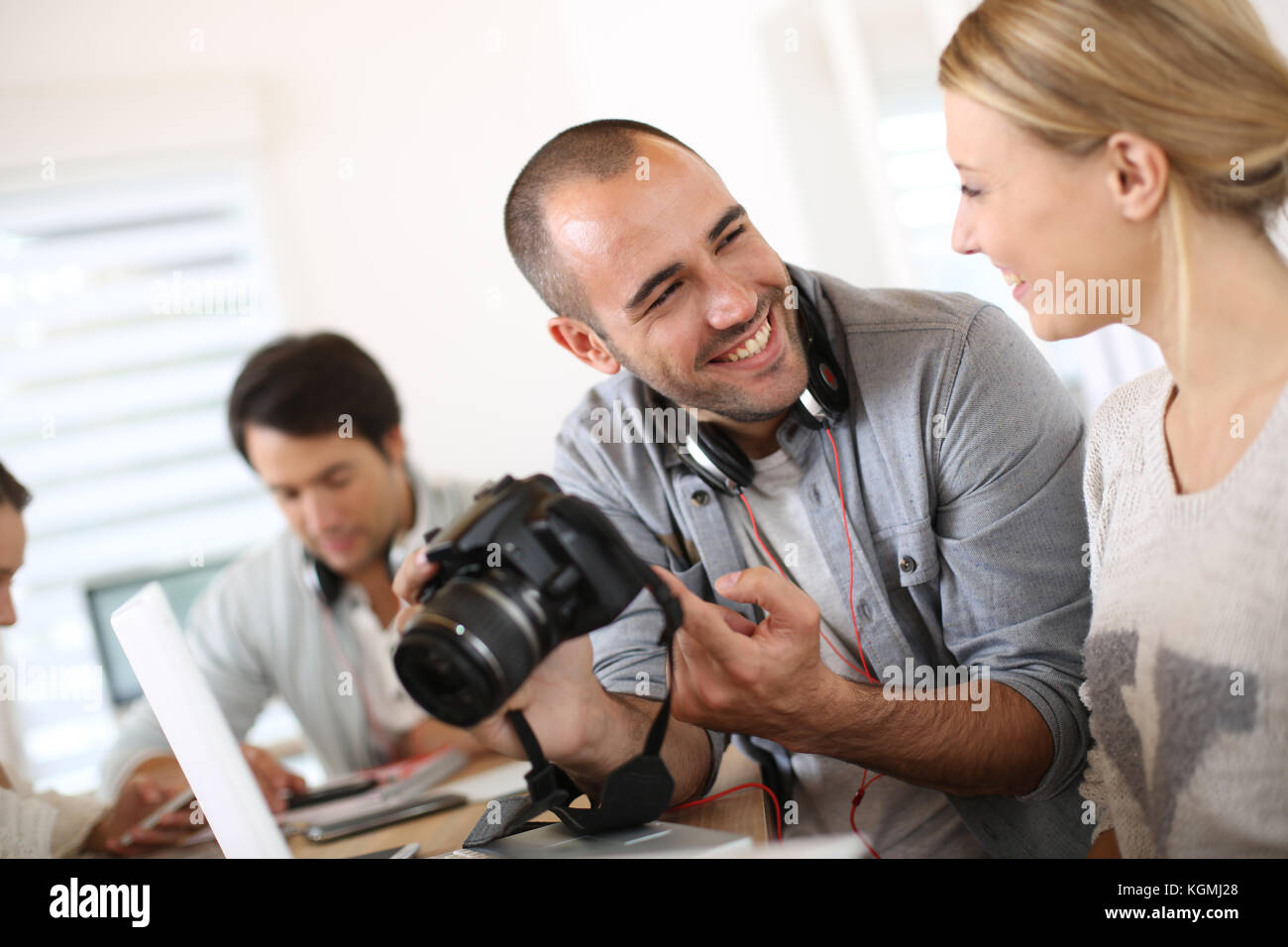 Students in photography working together on project Stock Photo - Alamy