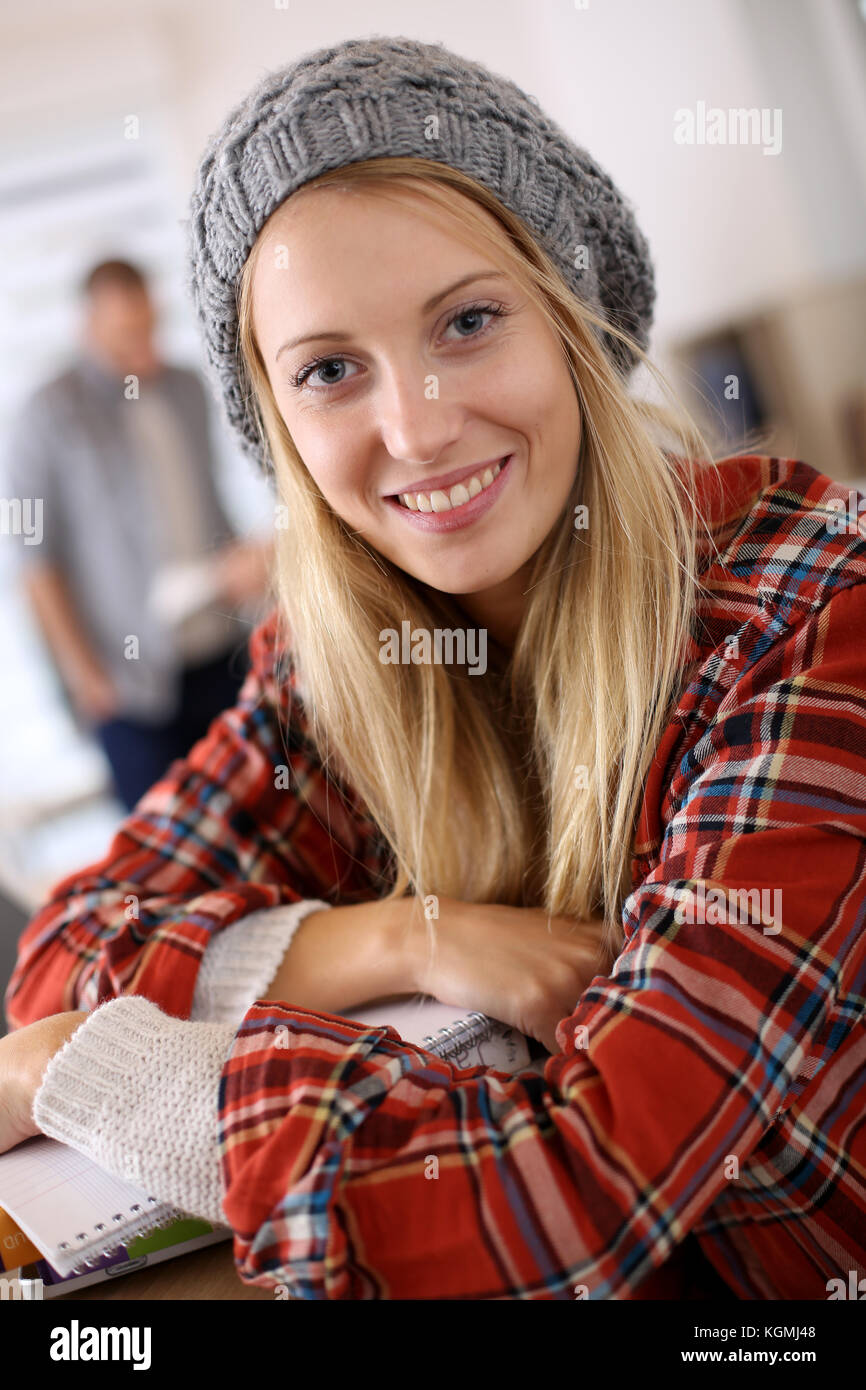 Trendy student girl sitting in class Stock Photo - Alamy