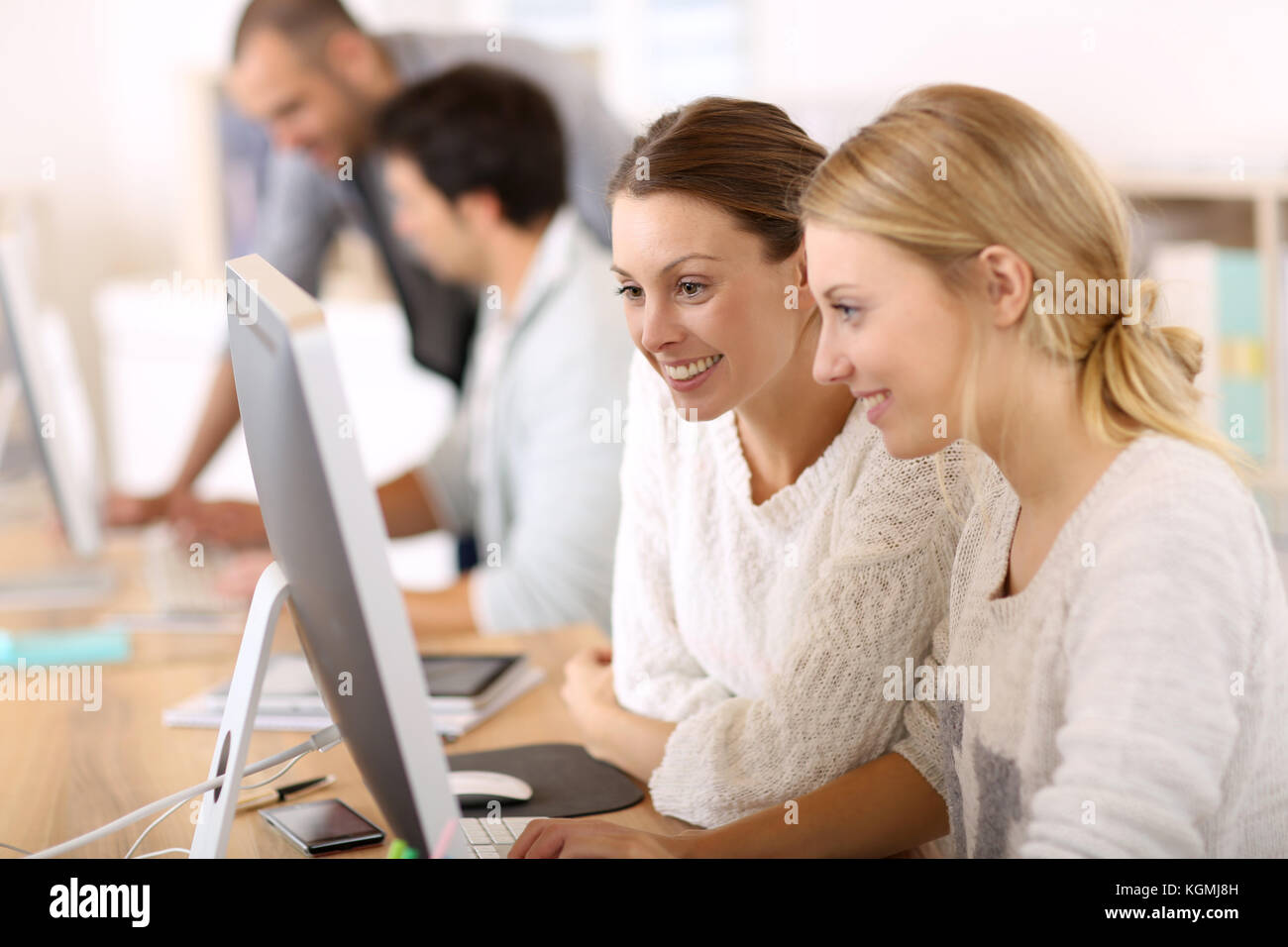 College girls working in front of desktop Stock Photo - Alamy