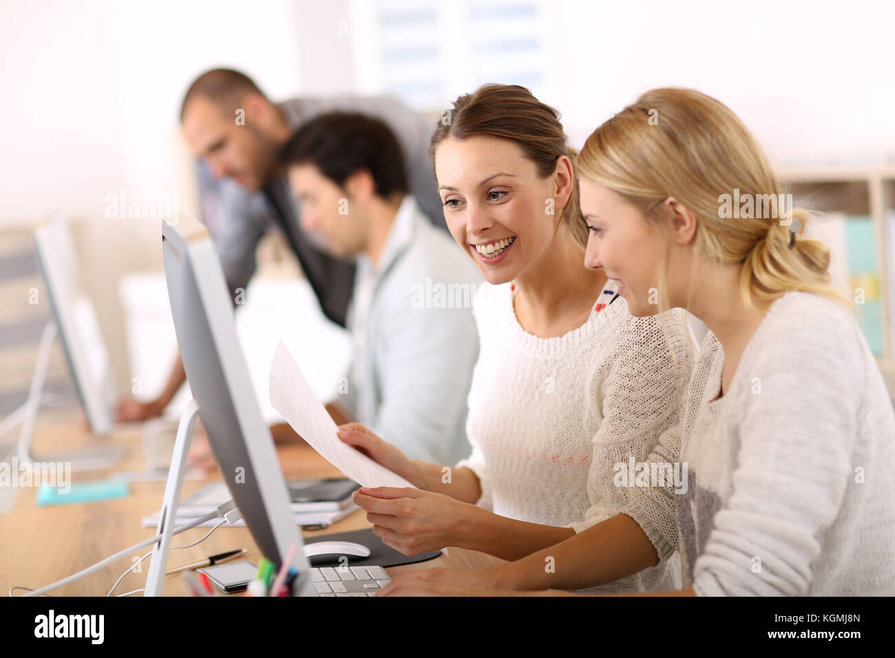 College girls working in front of desktop Stock Photo - Alamy