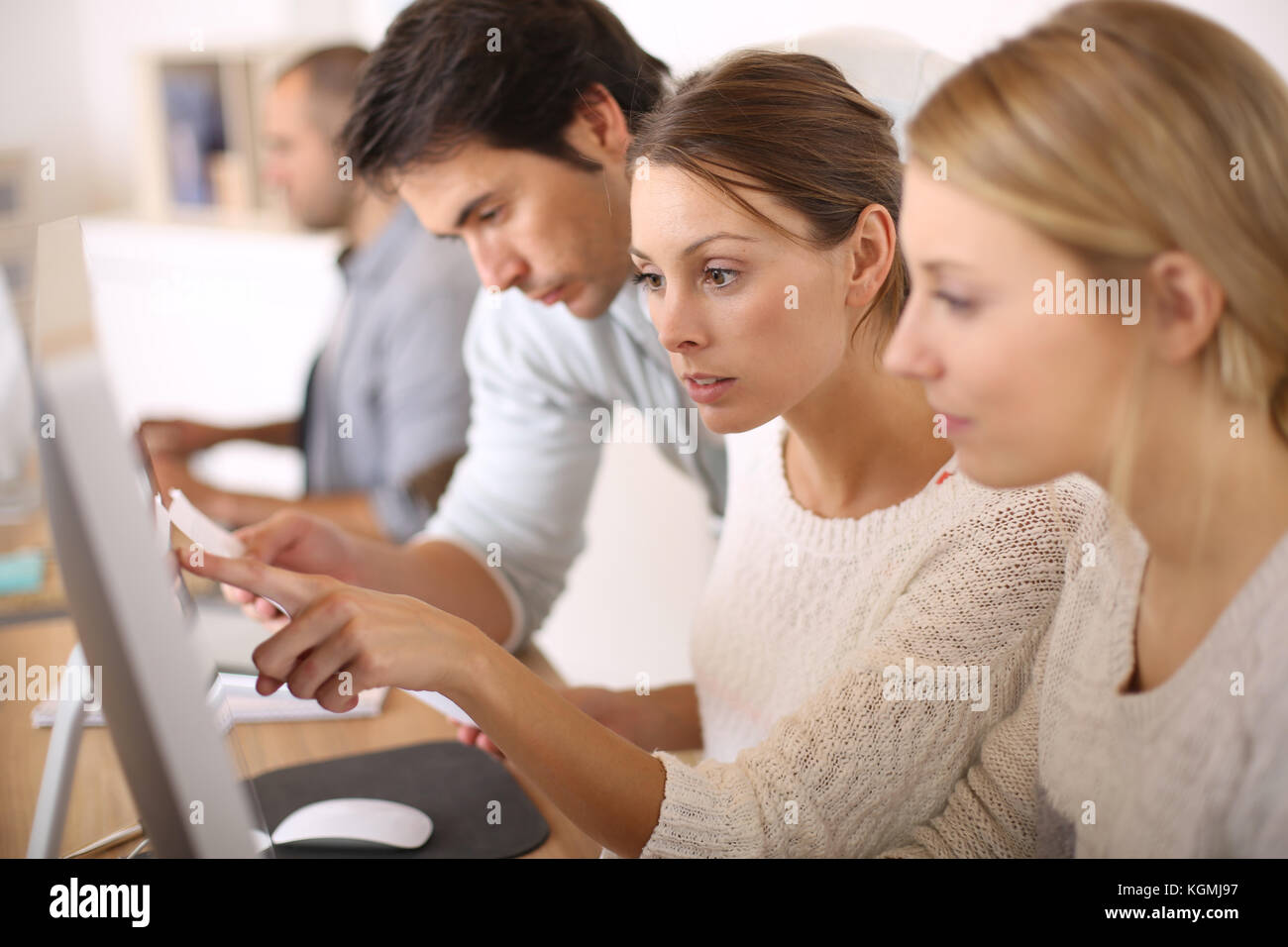 Group of students in business school Stock Photo - Alamy