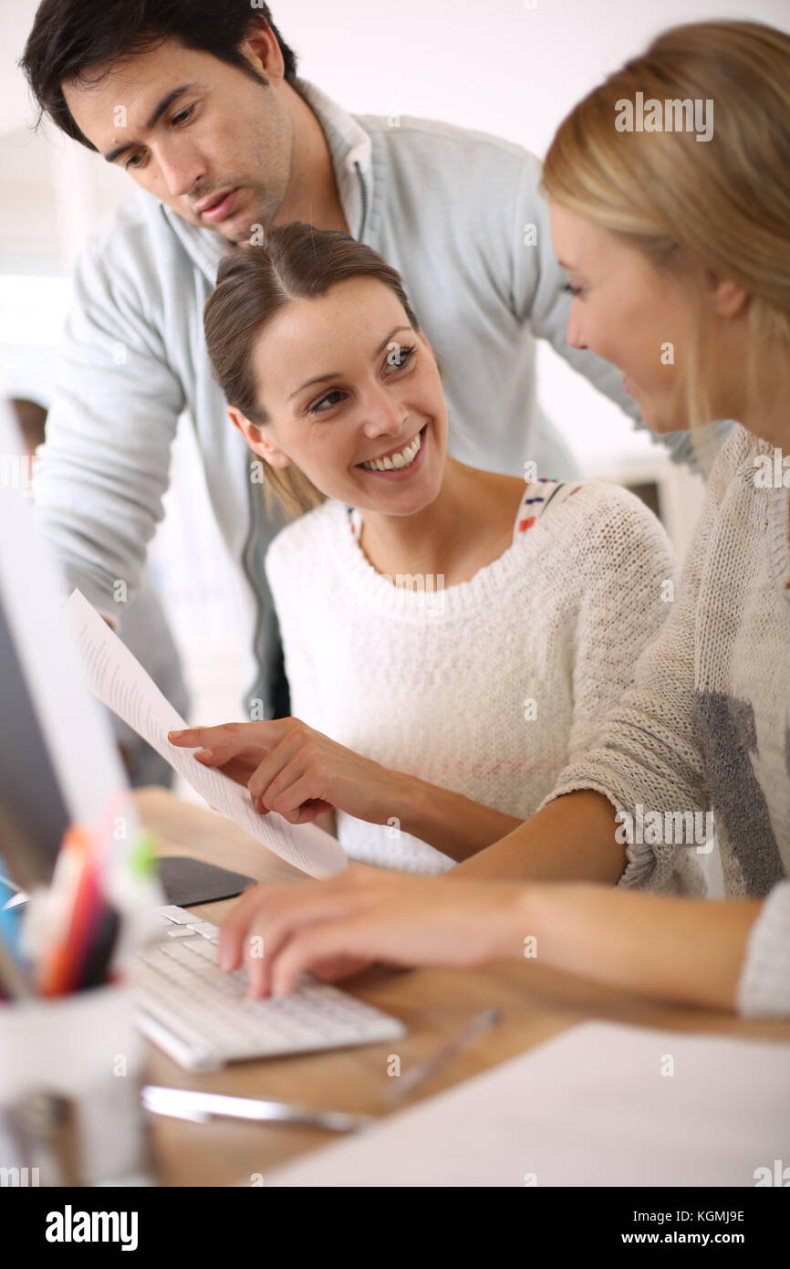 Group of students in business school Stock Photo - Alamy