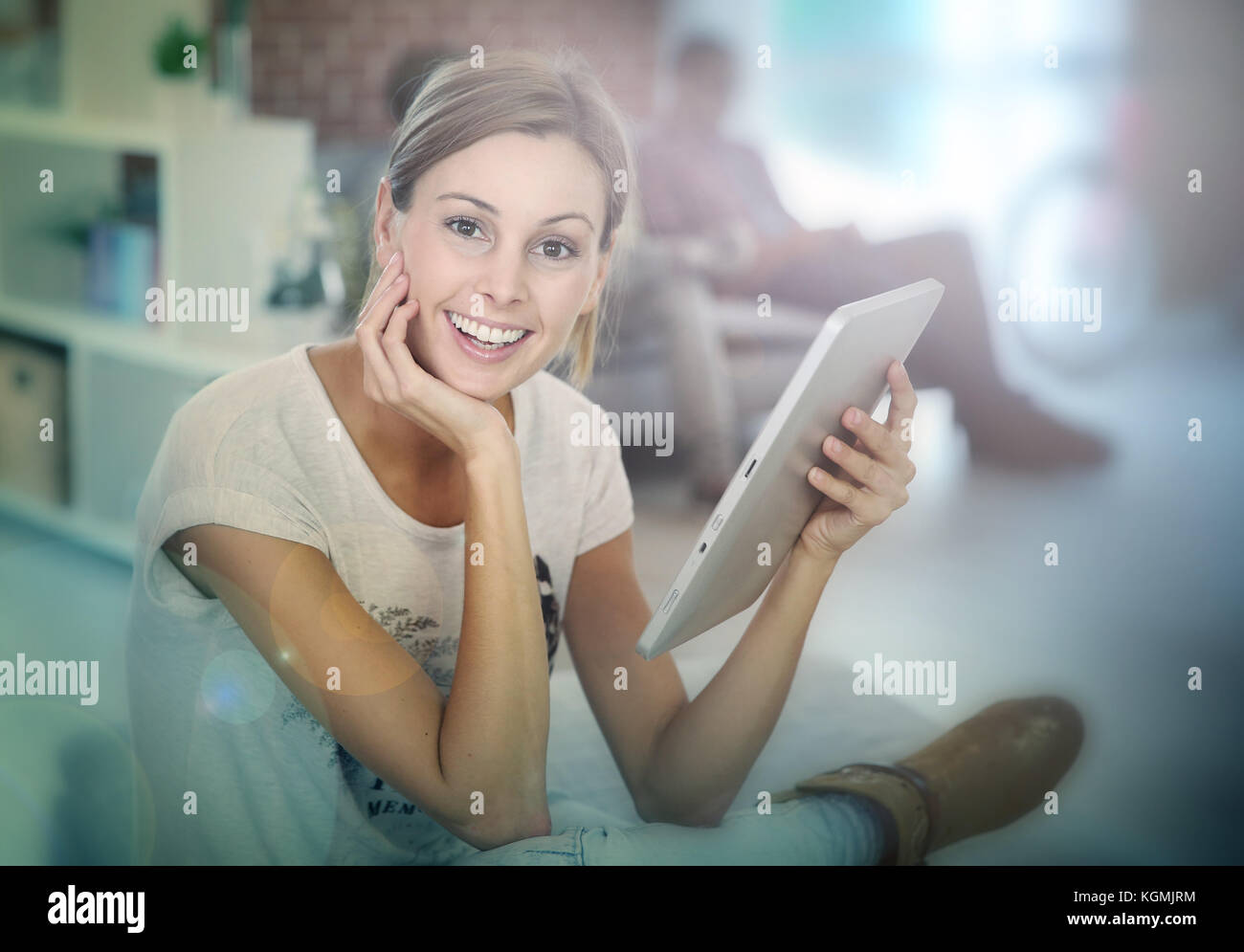 Young woman using digital tablet Stock Photo - Alamy