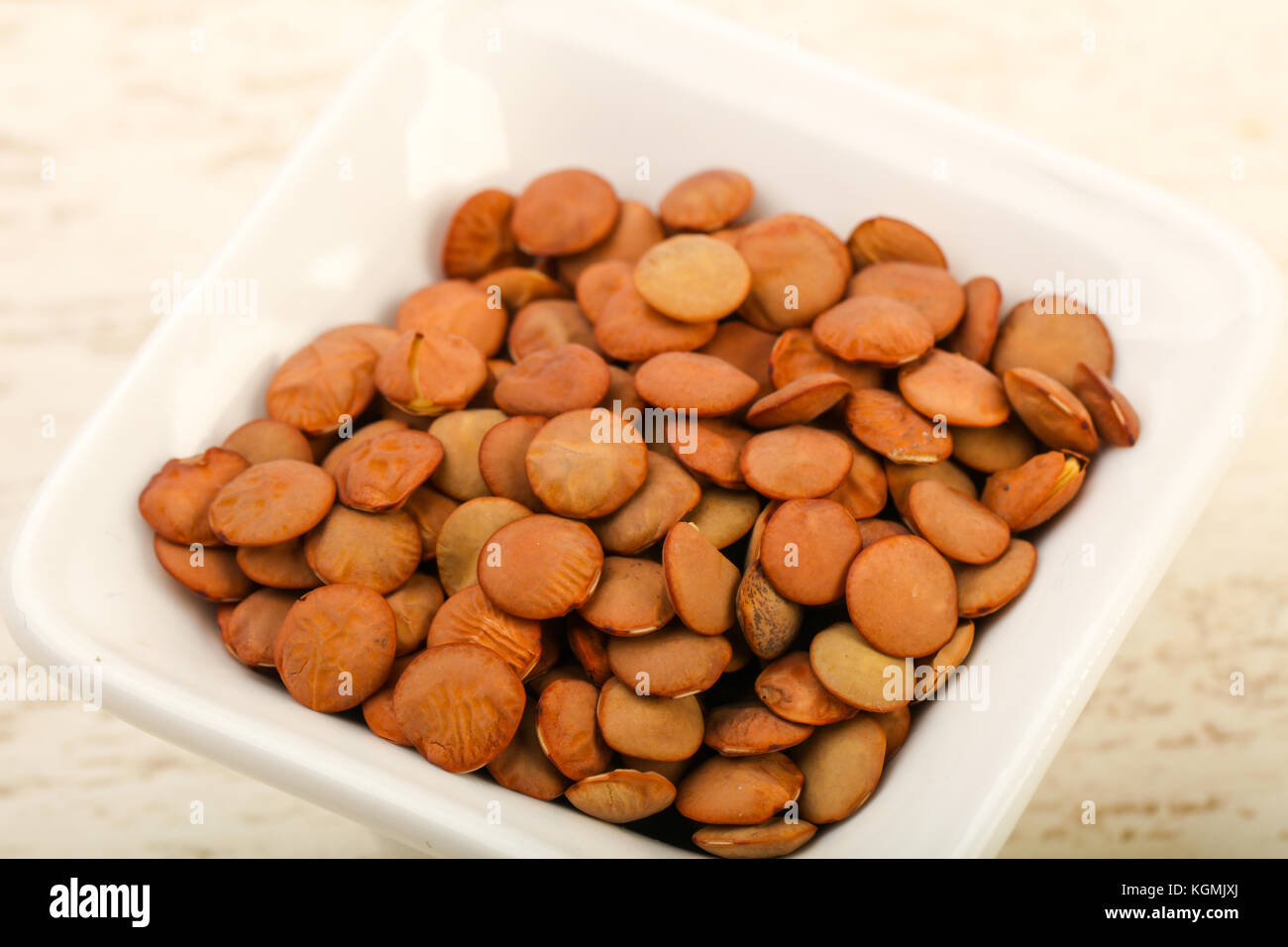 Raw lentils in the bowl ready for cooking Stock Photo - Alamy