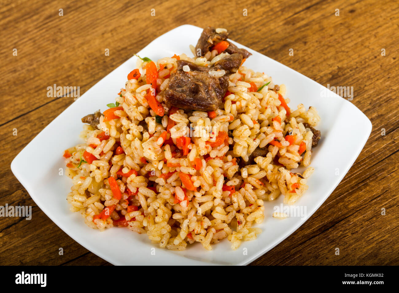 Asian rice - Plov with meat and carrot Stock Photo - Alamy