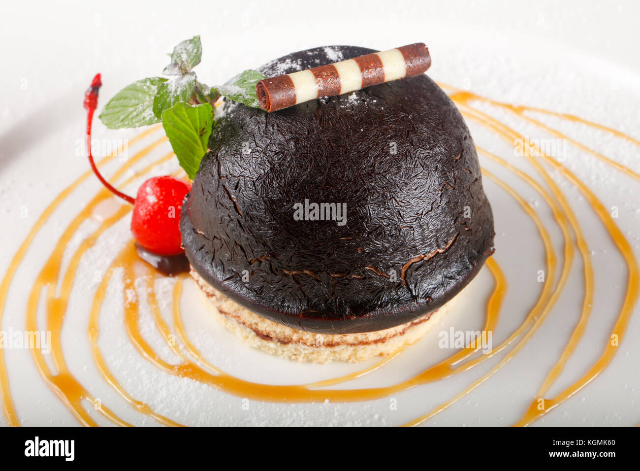 Chocolate cake with cherry and mint Stock Photo - Alamy
