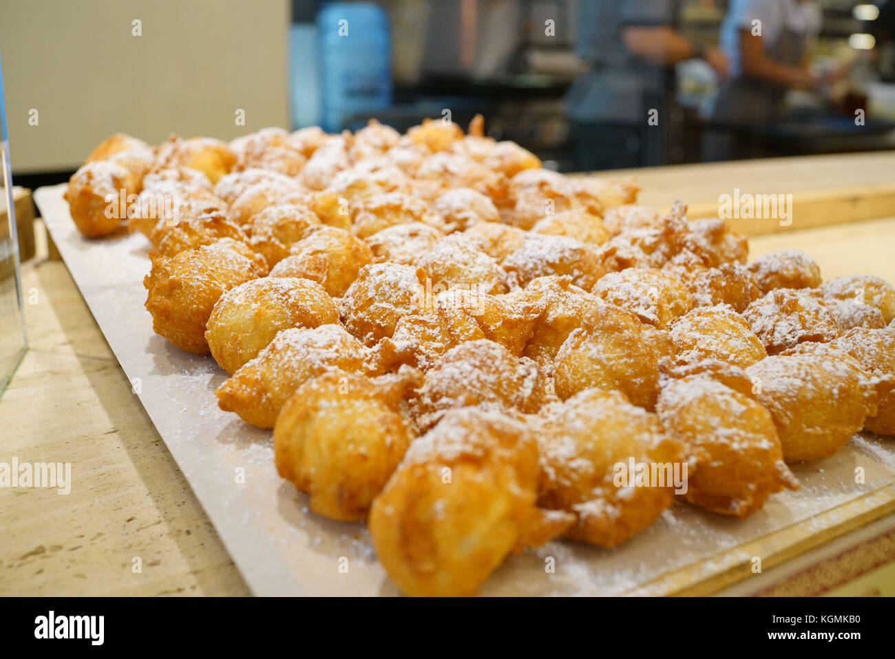 Puffs filled with custard cream in bakery shop window Stock Photo - Alamy