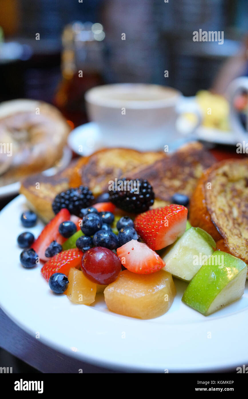 French toast with fruit salad set on restaurant table, NYC Stock Photo ...