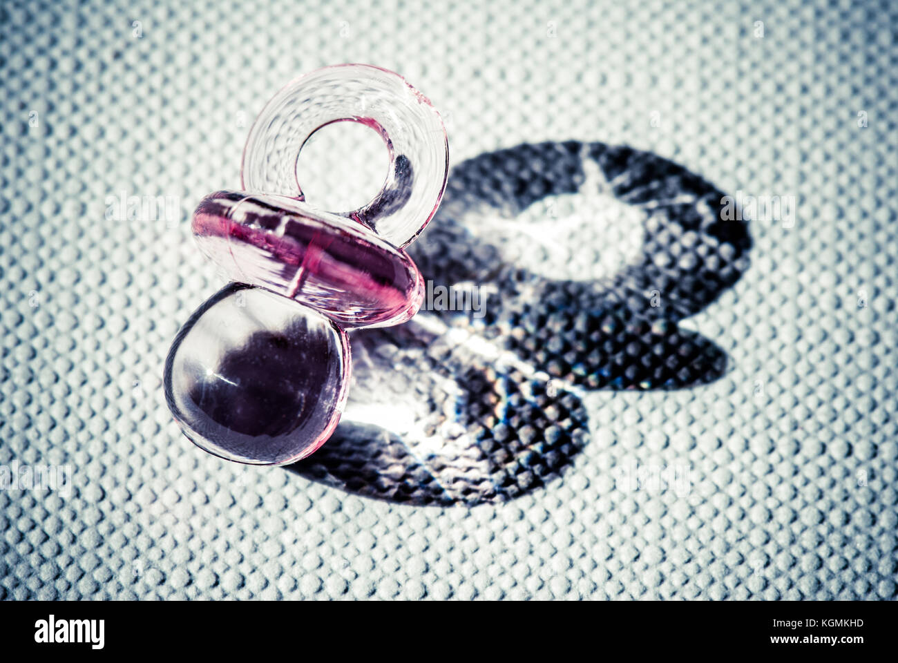 glass pacifier over canvas - still life wallpaper Stock Photo - Alamy