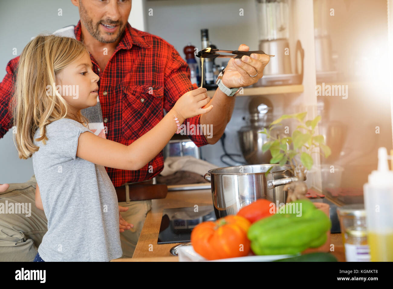 Daddy with daughter cooking together in home kitchen Stock Photo - Alamy