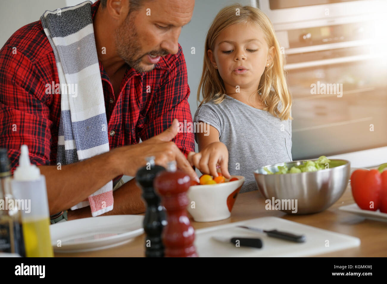 Father and daughter cooking pasta dish together Stock Photo - Alamy