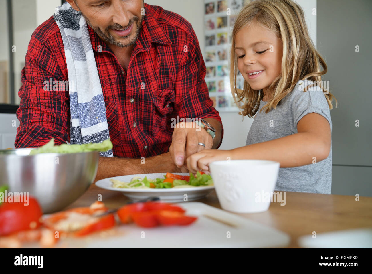 Father and daughter cooking pasta dish together Stock Photo - Alamy