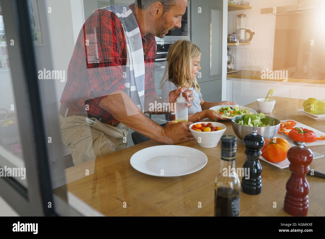 Father and daughter cooking pasta dish together Stock Photo - Alamy