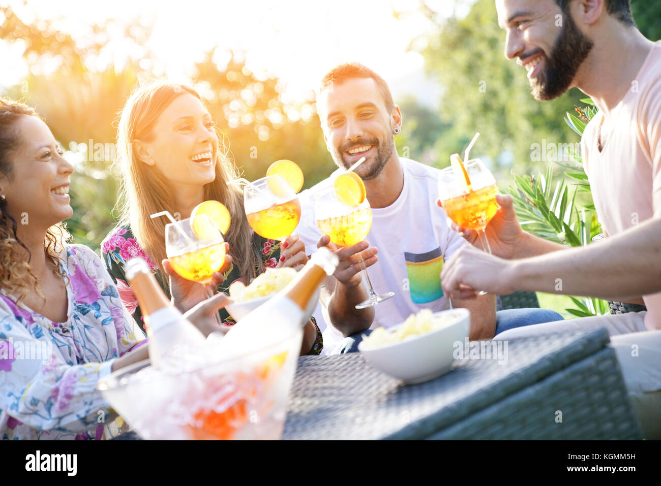 Group of friends cheering with summer cocktails Stock Photo - Alamy