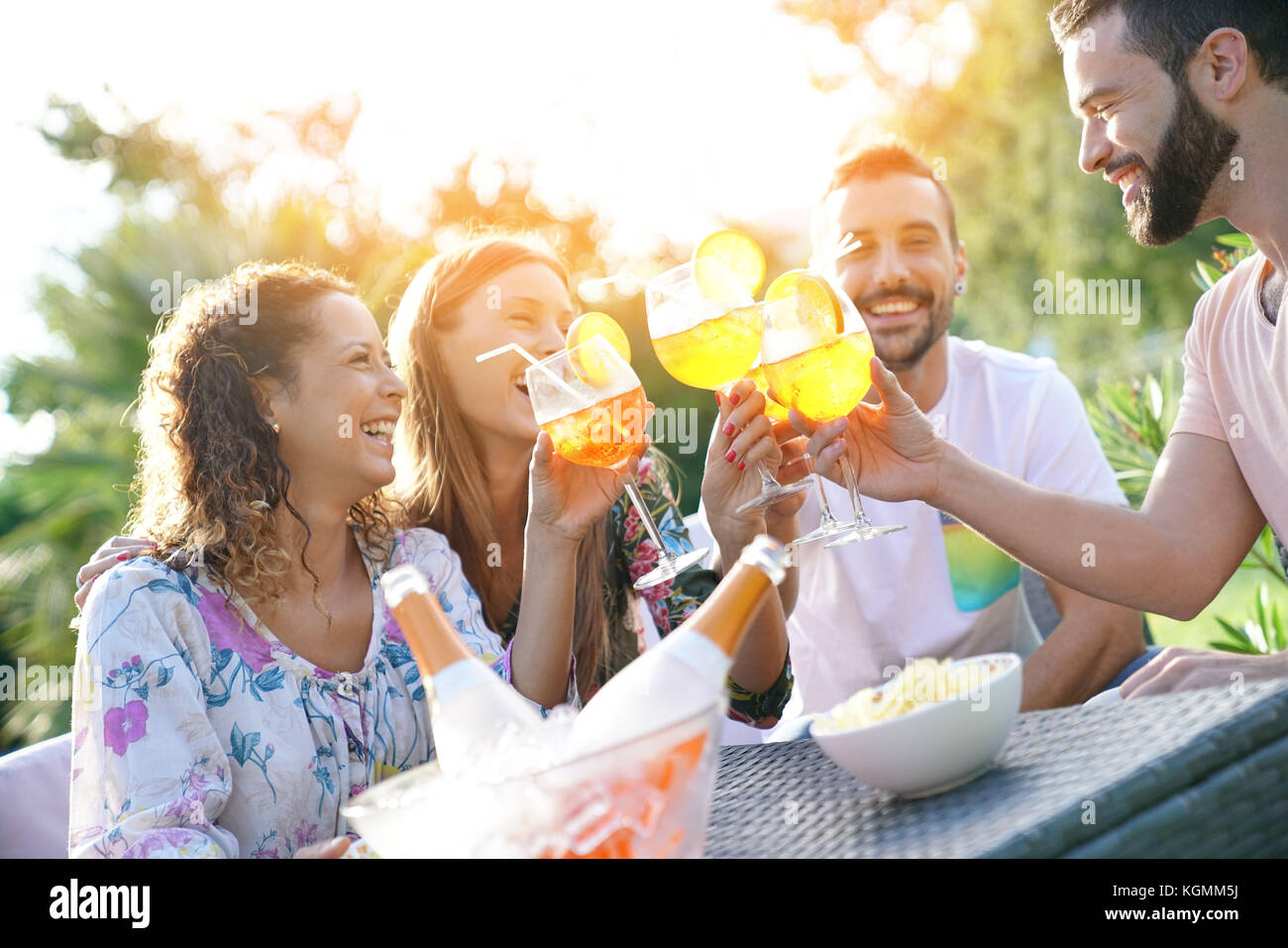 Group of friends cheering with summer cocktails Stock Photo - Alamy