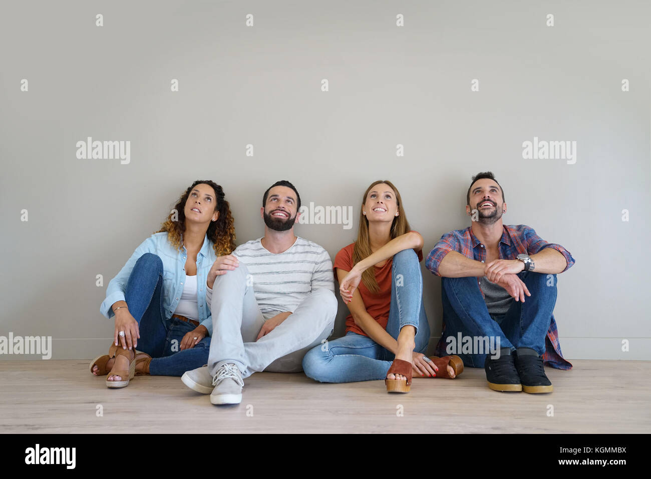 Friends looking up at message, isolated Stock Photo - Alamy